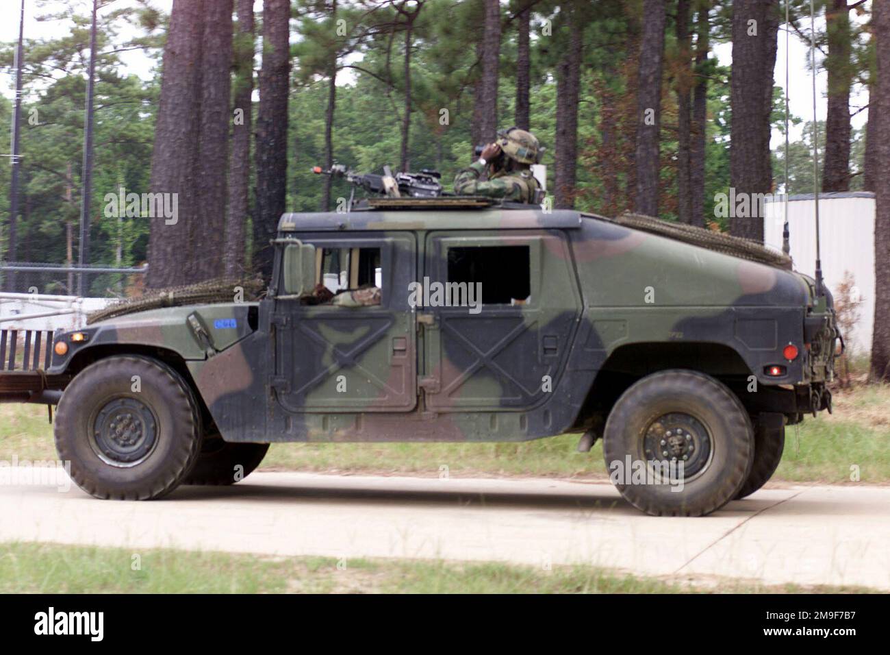 A soldier from Mountain Eagle Joint Task Force keeps watch from atop ...