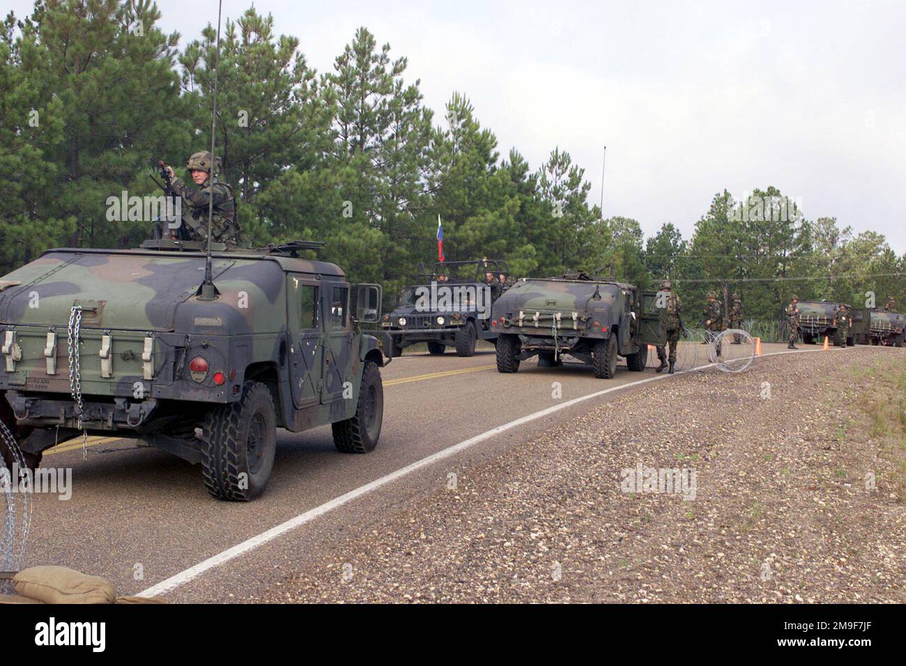 High-Mobility Multipurpose Wheeled Vehicles (HMMWV) pass through a ...