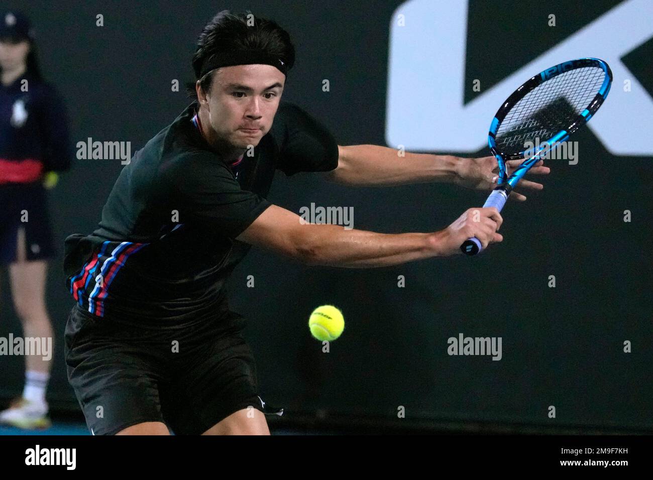 Taro Daniel of Japan plays a backhand return to Denis Shapovalov of ...