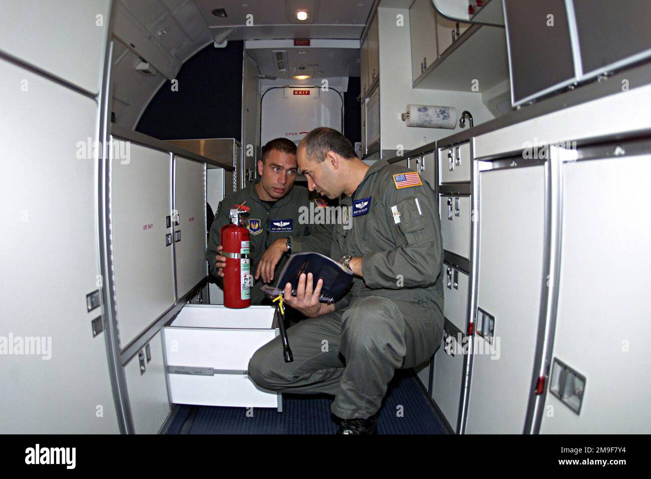Medium shot, aircraft interior, STAFF Sergeant Lenny Eichsteadt (left ...