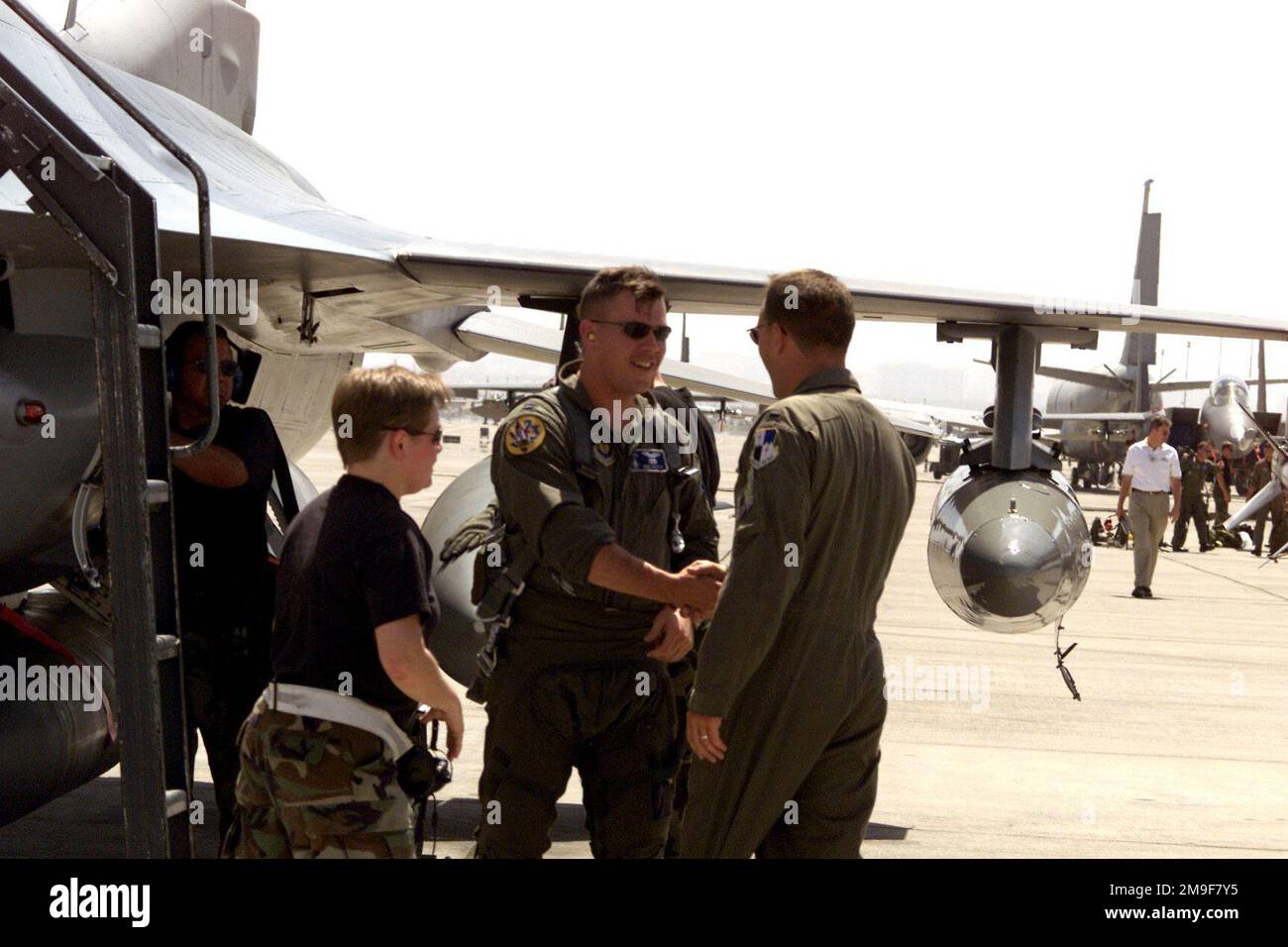 Medium shot, Captain Robert PETTY, USAF is greeted by First Lieutenant ...