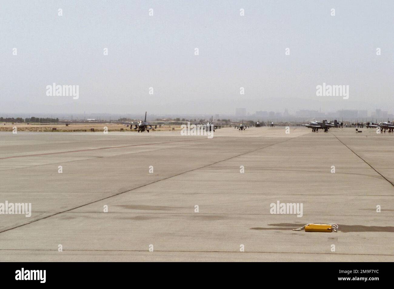 Long shot, left front view, six F-16 Fighting Falcons in a long single ...