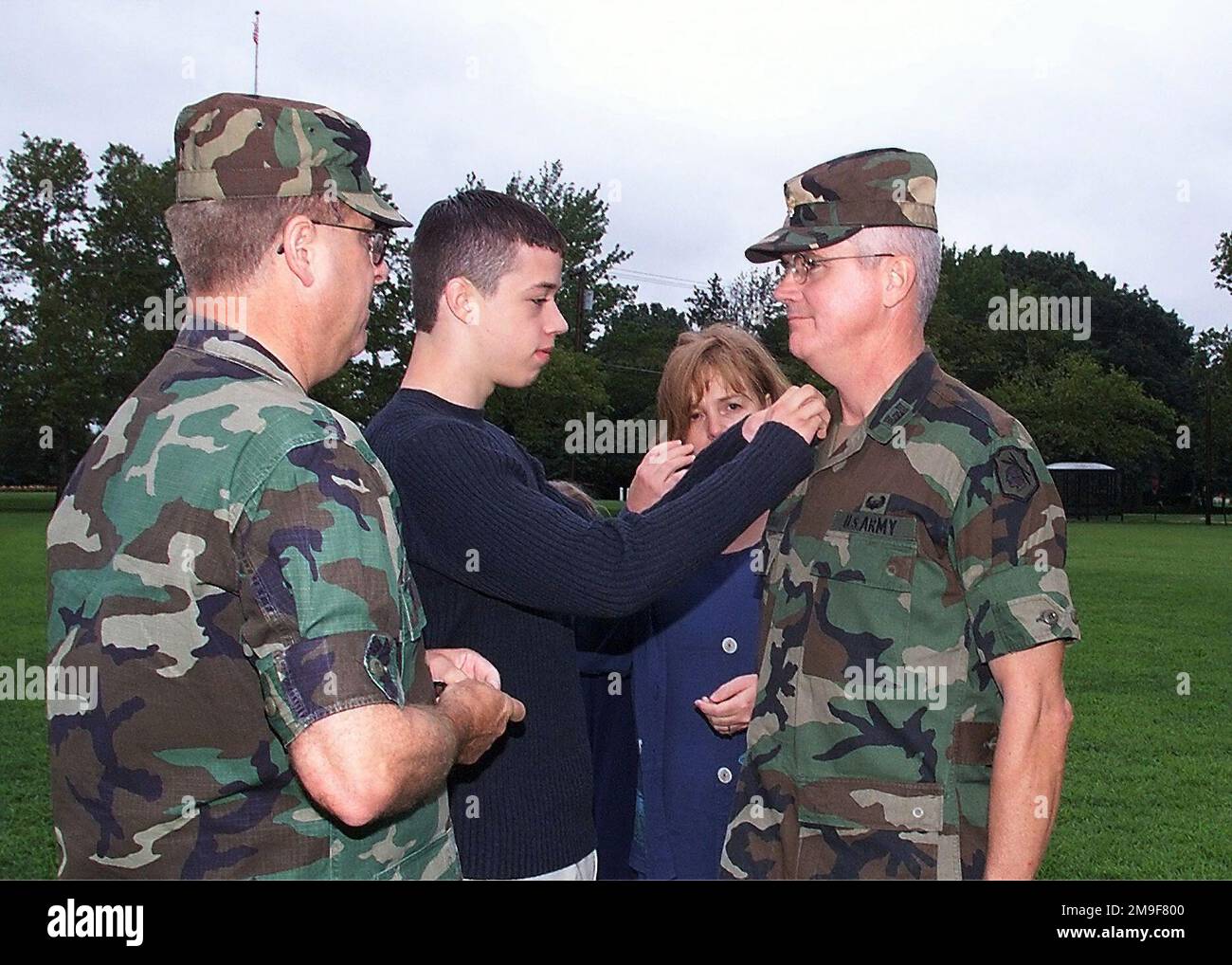 Lieutenant Colonel Satterfields son Sean, 16, pins his fathers new rank on him, as Lieutenant ...