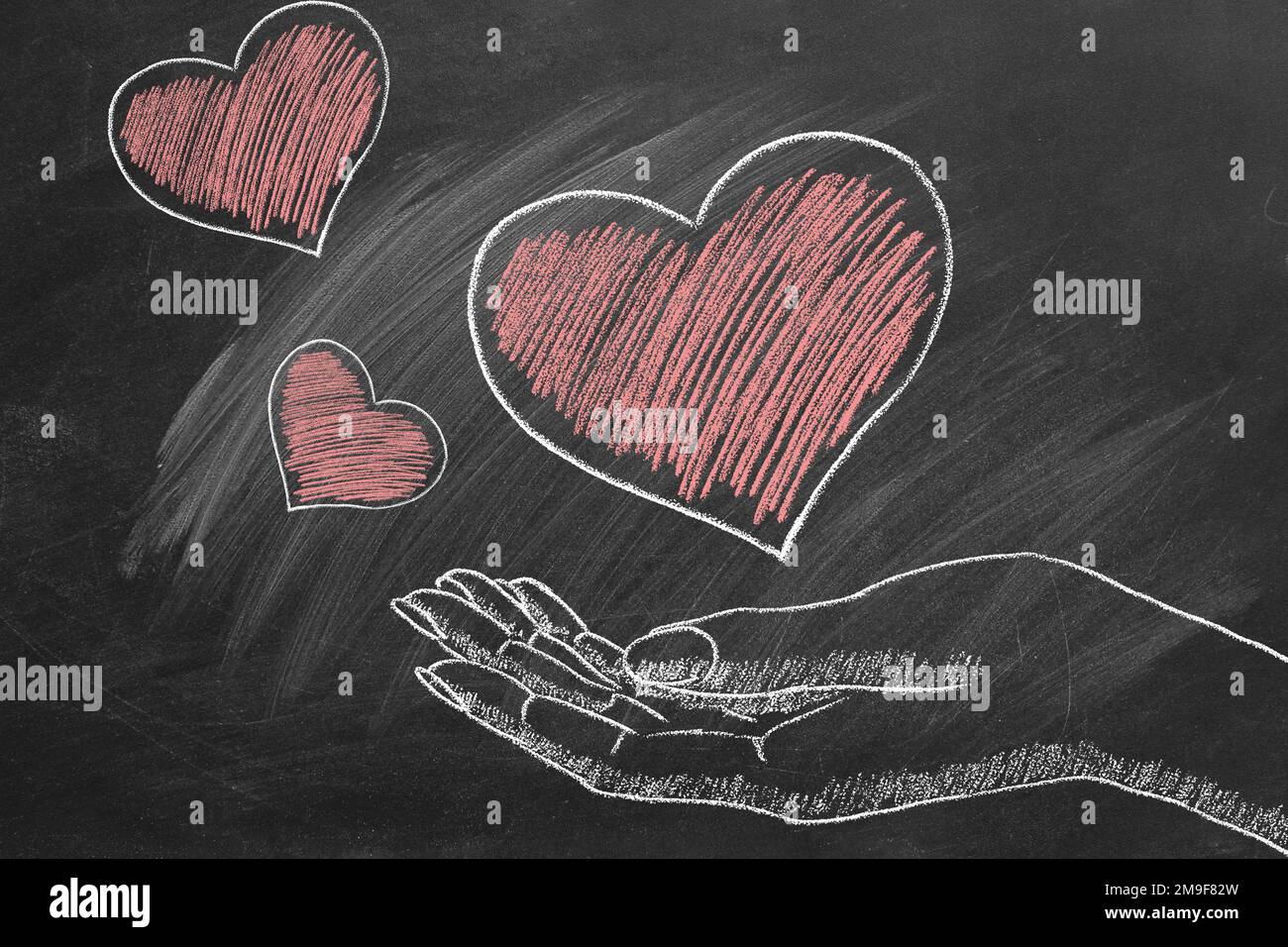 Hearts in a female hand. Chalk drawn illustration. Heart transplant and ...