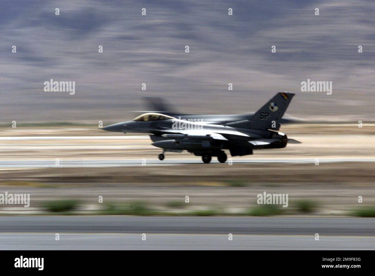 Medium long shot, left side view, F-16C Fighting Falcon on take off ...