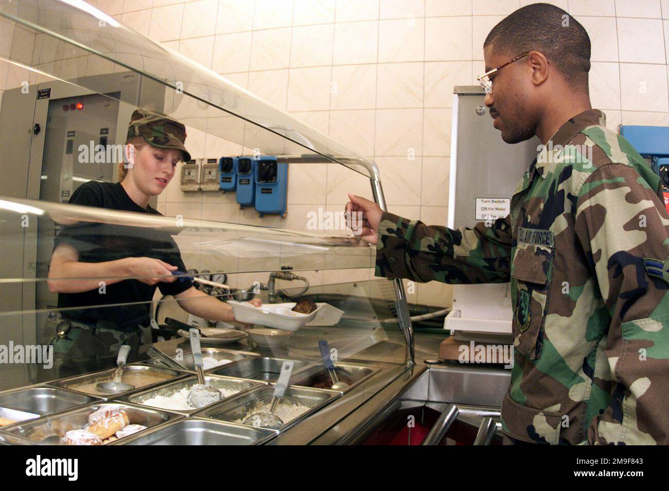 Right side front view medium shot as US Air Force SENIOR AIRMAN ...