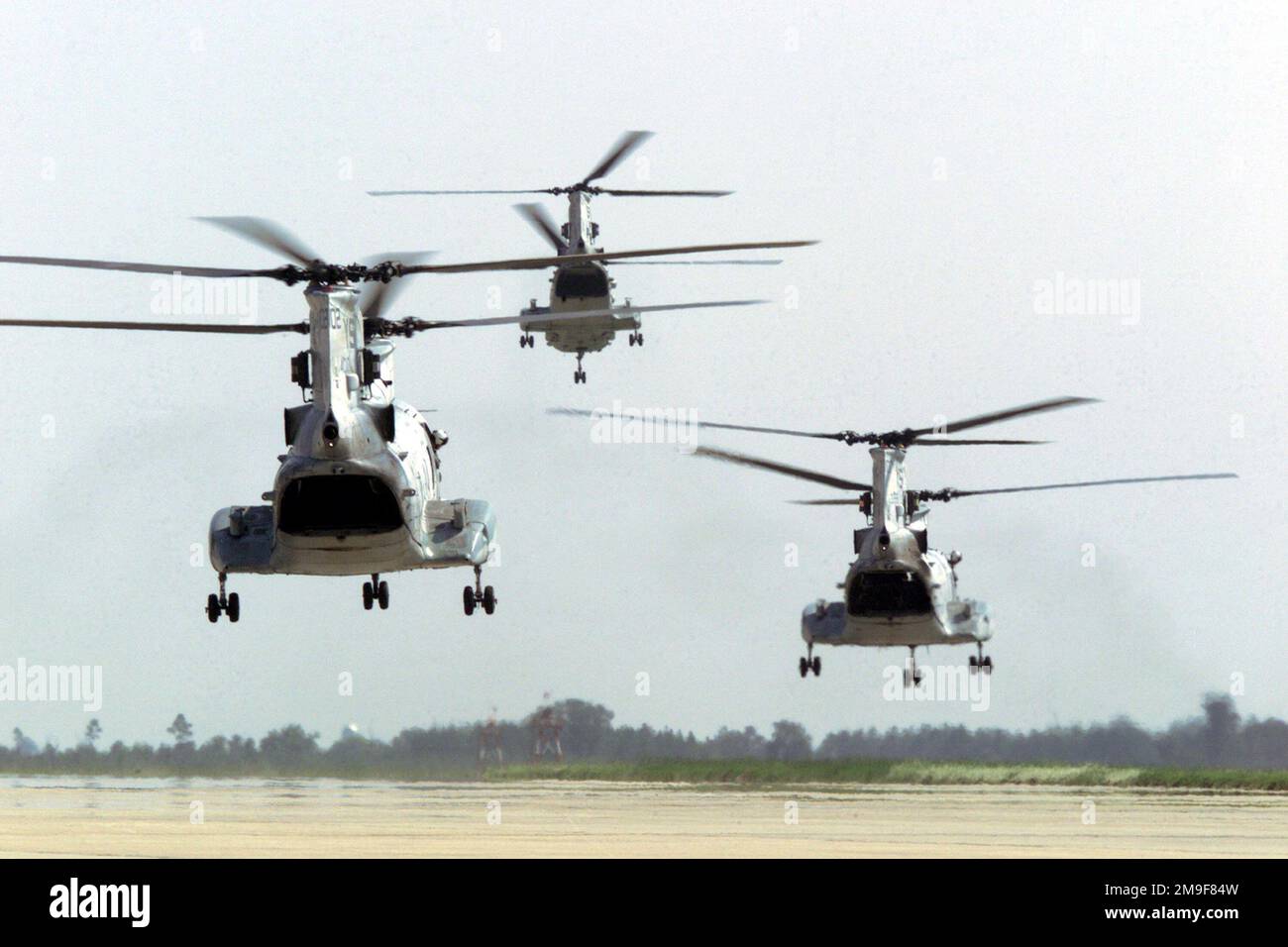 Three United States Marine Corps CH-46E Sea Knight helicopters depart ...