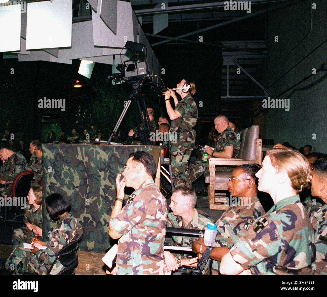 US Army SPECIALIST Soto shoots participants with a video during a ...