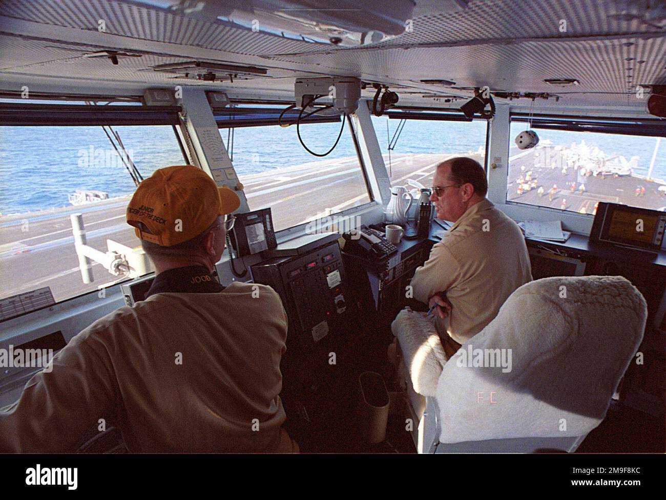 US Navy Captain David Logsdon, Commanding Officer, USS HARRY S. TRUMAN (CVN 75), watches flight ...