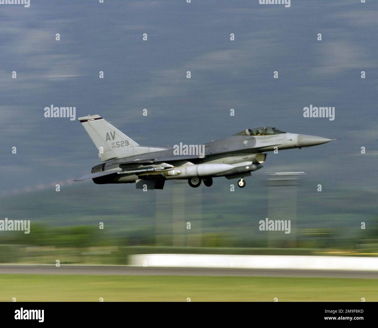 Right side profile medium shot as a US Air Force F-16 Falcon from the ...
