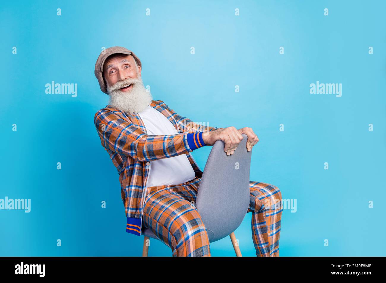 Photo of cool attractive retired man dressed plaid suit sitting riding ...