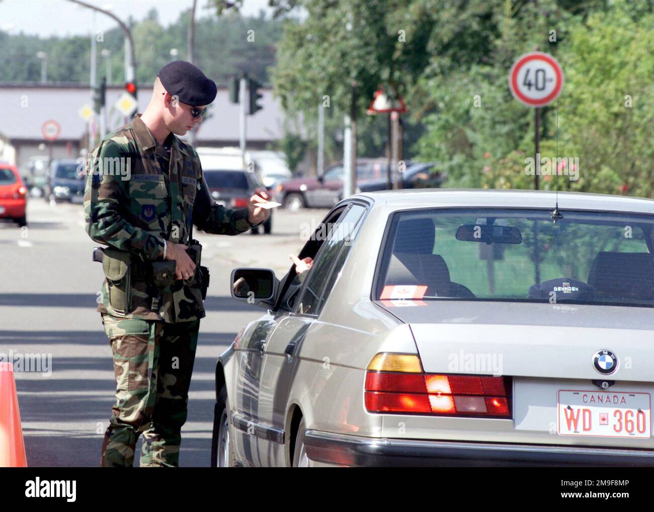 US Air Force SENIOR AIRMAN McCarthy verifies ID cards during gate guard ...