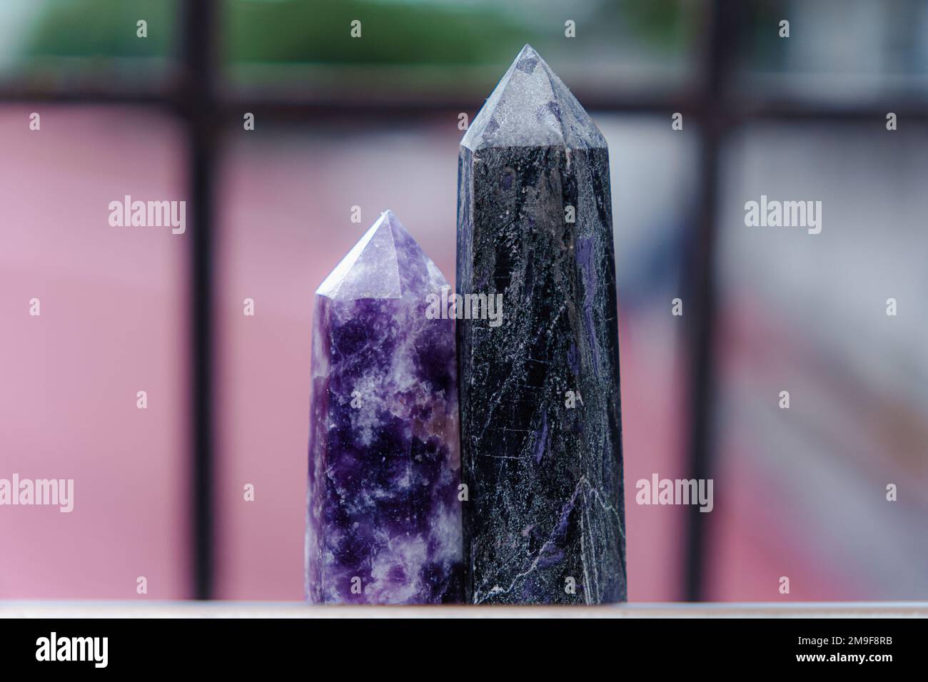 A closeup of a stunning polished hypersthene and amethyst crystals ...