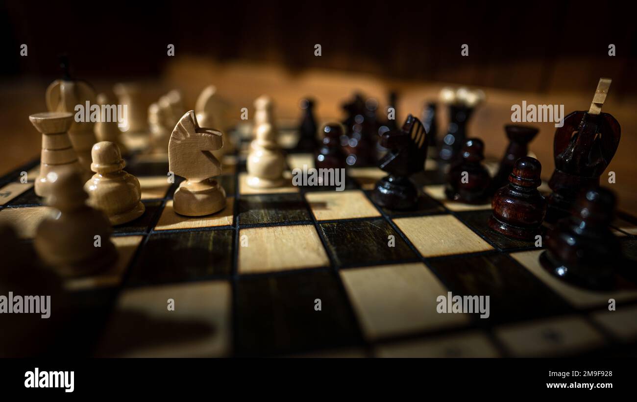 Blurred background with a low depth of focus. The set of wooden chess ...