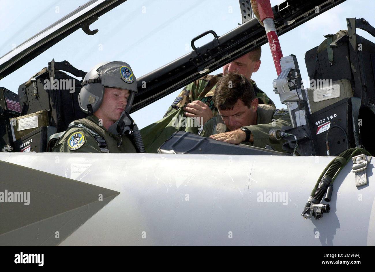 Mr. Dale Zimmerman (Left) is given a final check out before his flight by US Air Force ...