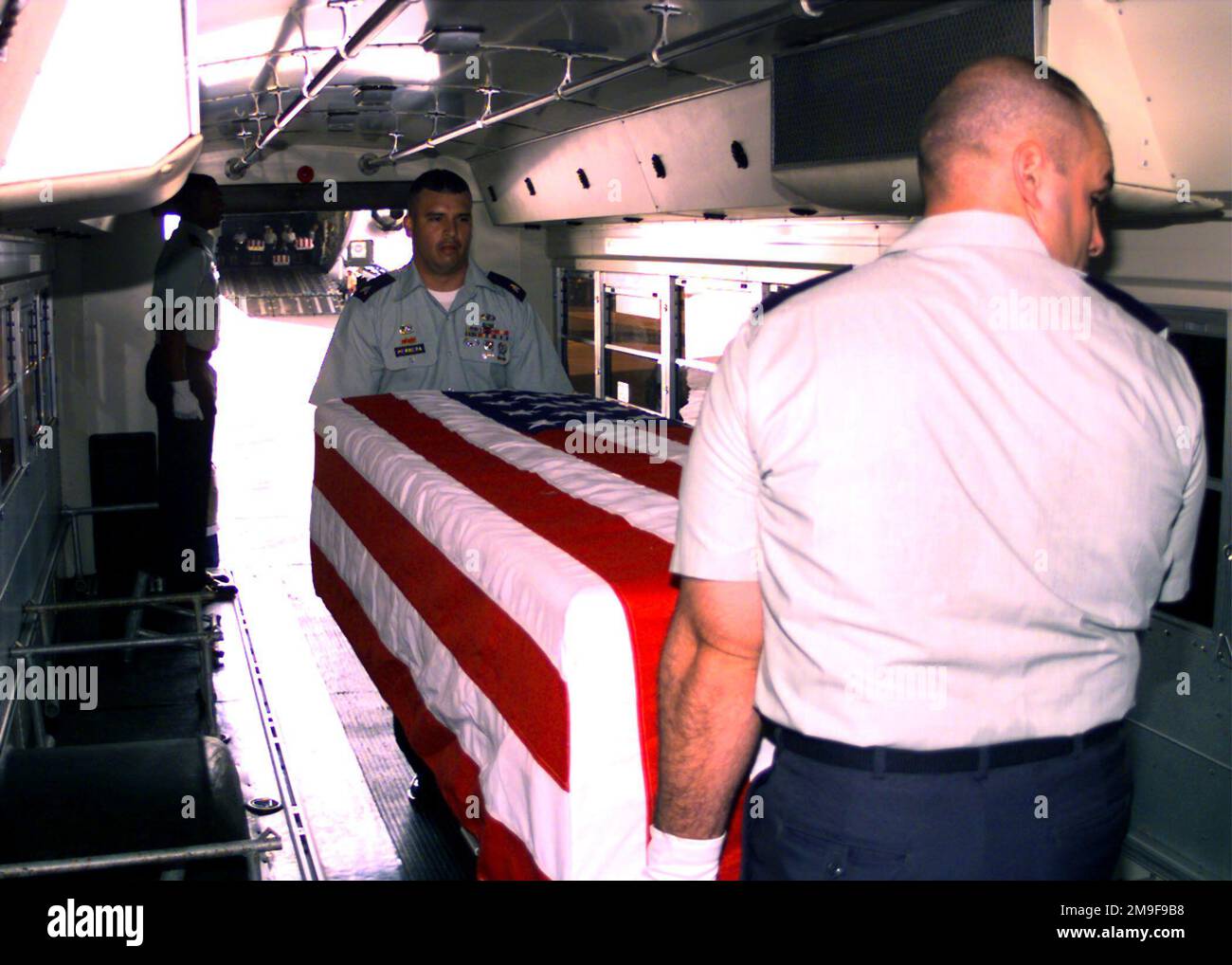 Members of a Joint Services Honor Guard carry remains to be identified ...