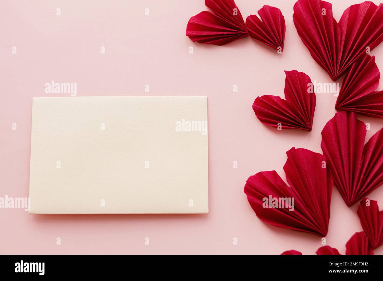 Happy Valentine's day! Empty card and stylish red hearts flat lay on ...