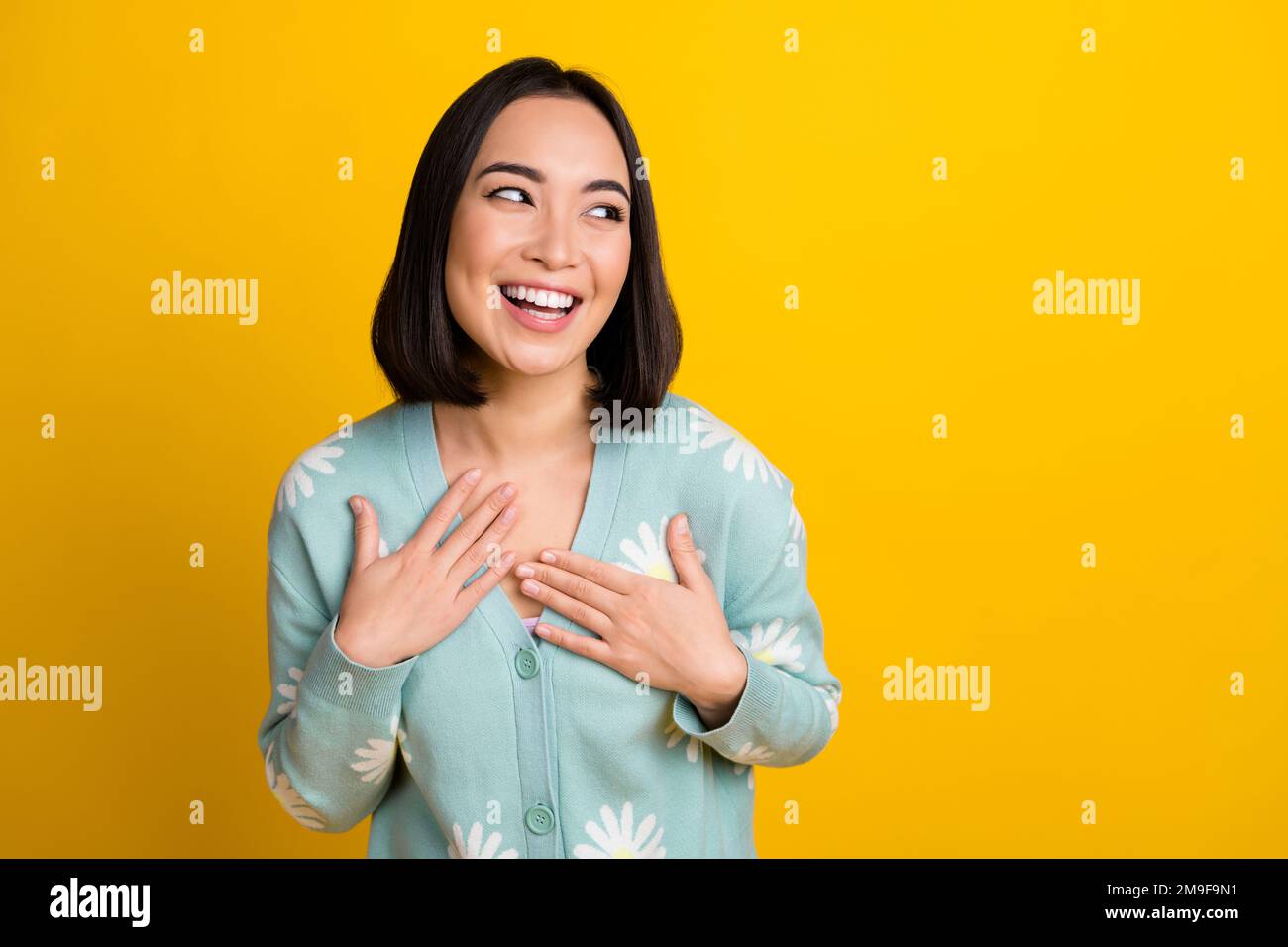 Photo of funny overjoyed satisfied chinese woman touch chest laughing ...
