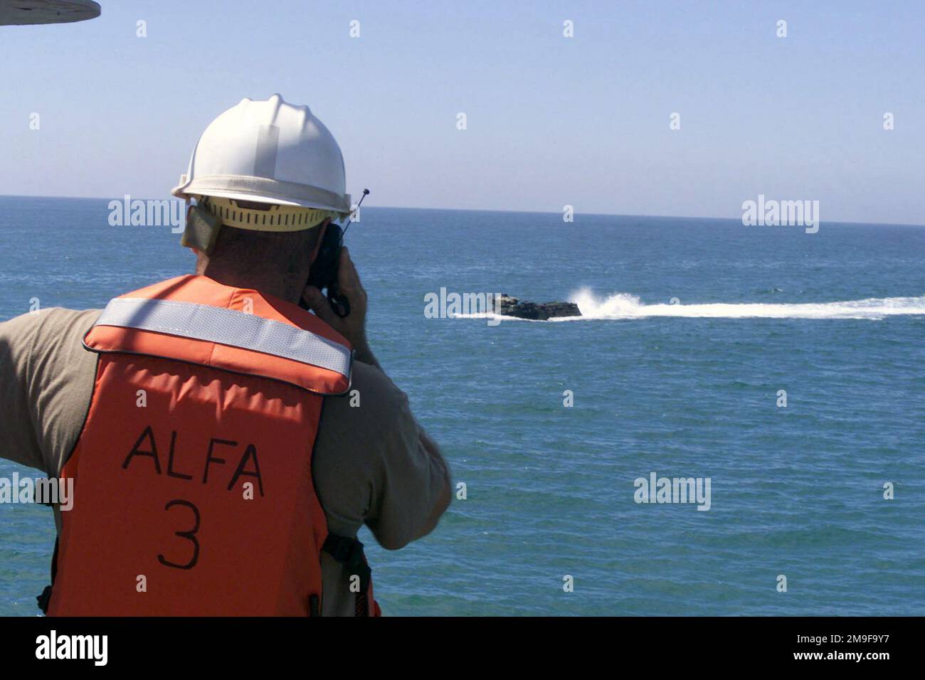 A US Navy (USN) Seabee, assigned to Amphibious Construction Battalion ...