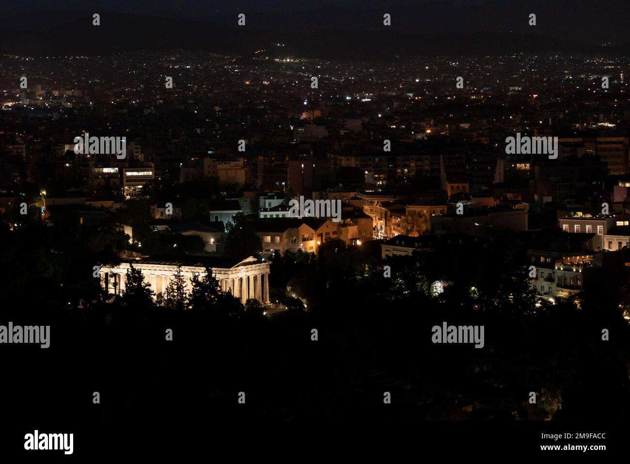 A night view of the cityscape of Athens, Greece with Temple of ...