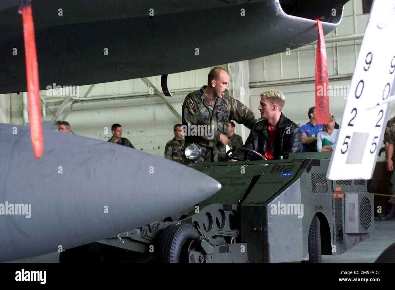 Dale Earnhardt Jr., 1999 NASCAR Busch Champion, receives instructions ...