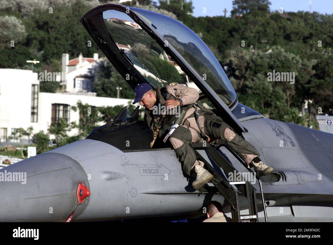 US Air Force Captain Tony Meyer prepares to leave his F-16 Fighting ...