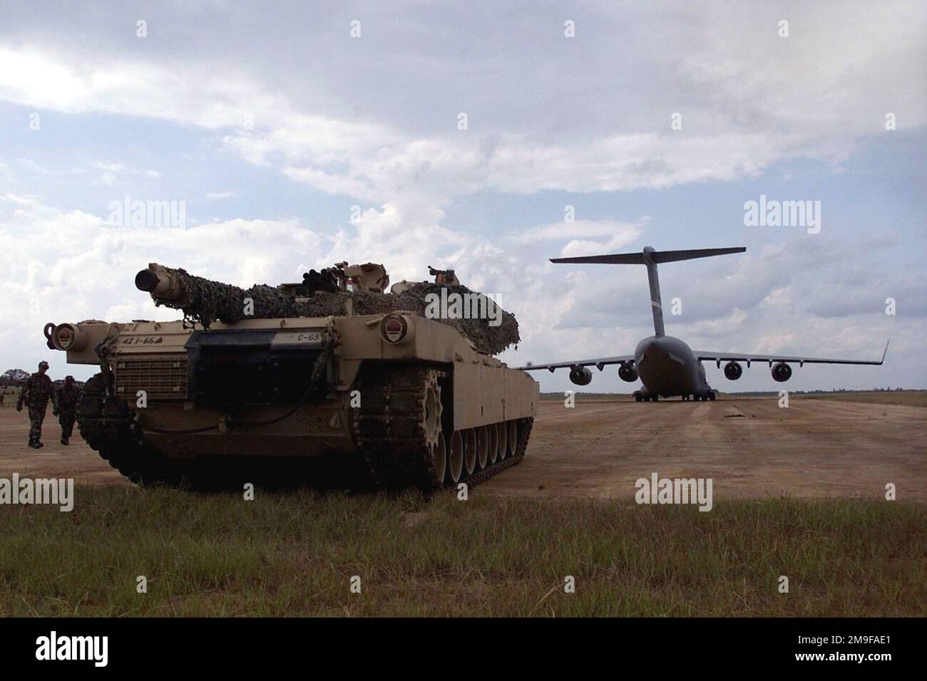A C-17 Globemaster III performs engine running offloads of the Army M1 ...