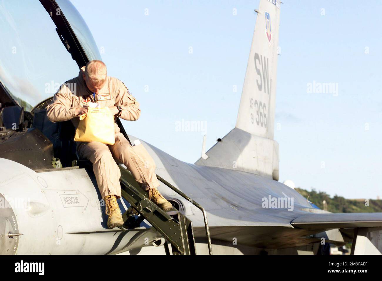 US Air Force Captain Vincent Cyran prepares to exit his F-16CJ aircraft ...