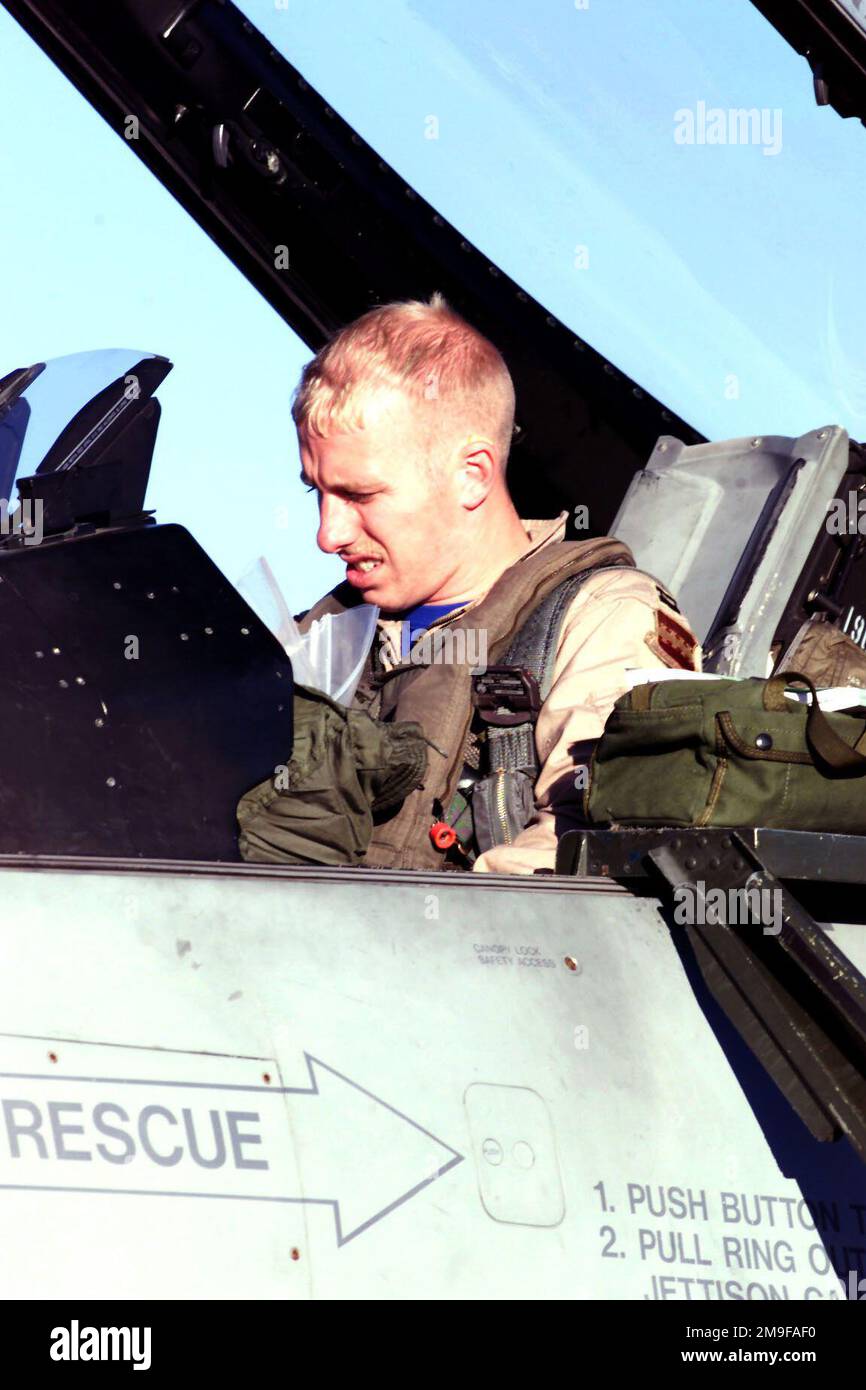 US Air Force Captain Vincent Cyran prepares to exit his F-16CJ aircraft ...