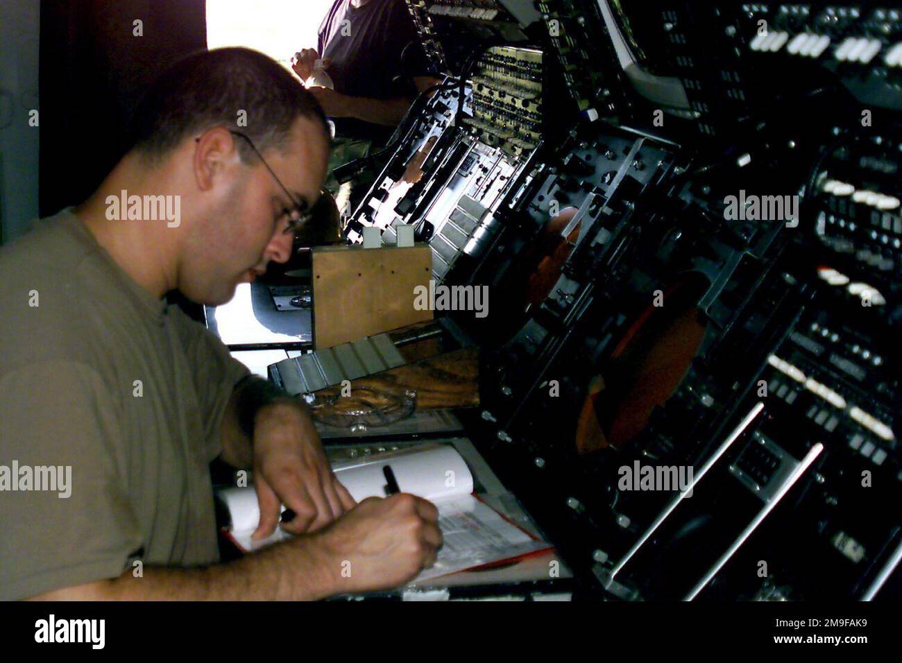 A US Air Force AIRMAN sits at an air traffic control station. The 245th ...