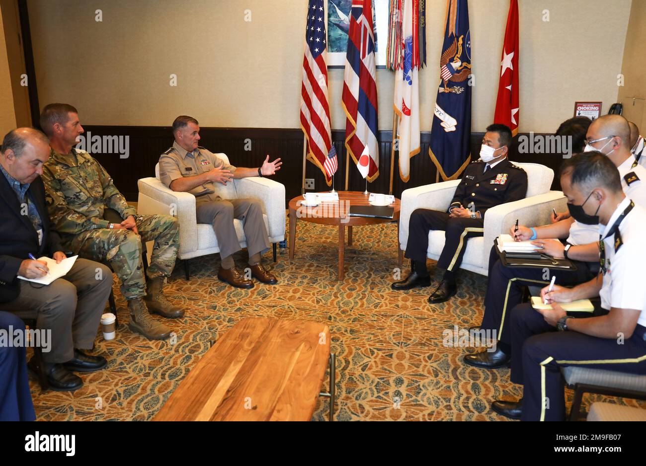 Gen. Charles A. Flynn, left center, commander of U.S. Army Pacific, and ...