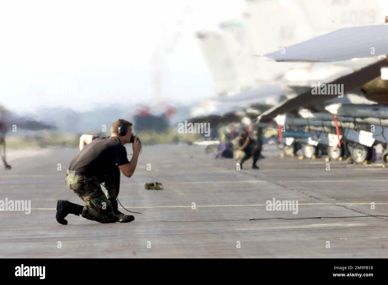 United States Air Force AIRMAN First Class John Bolz looks on as the ...