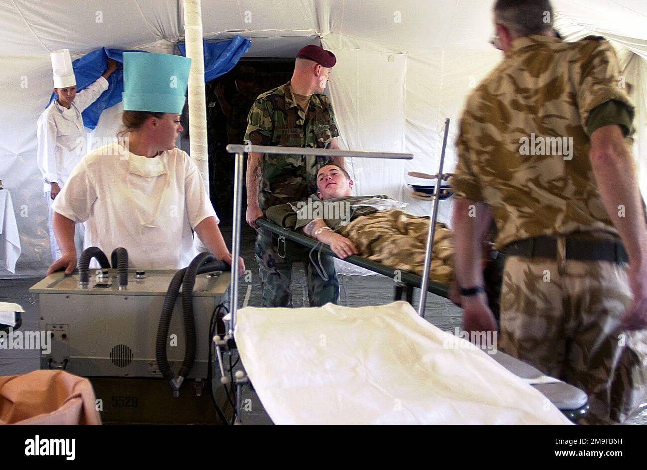 A patient is carried through a Kazakhstan Army operating room during ...