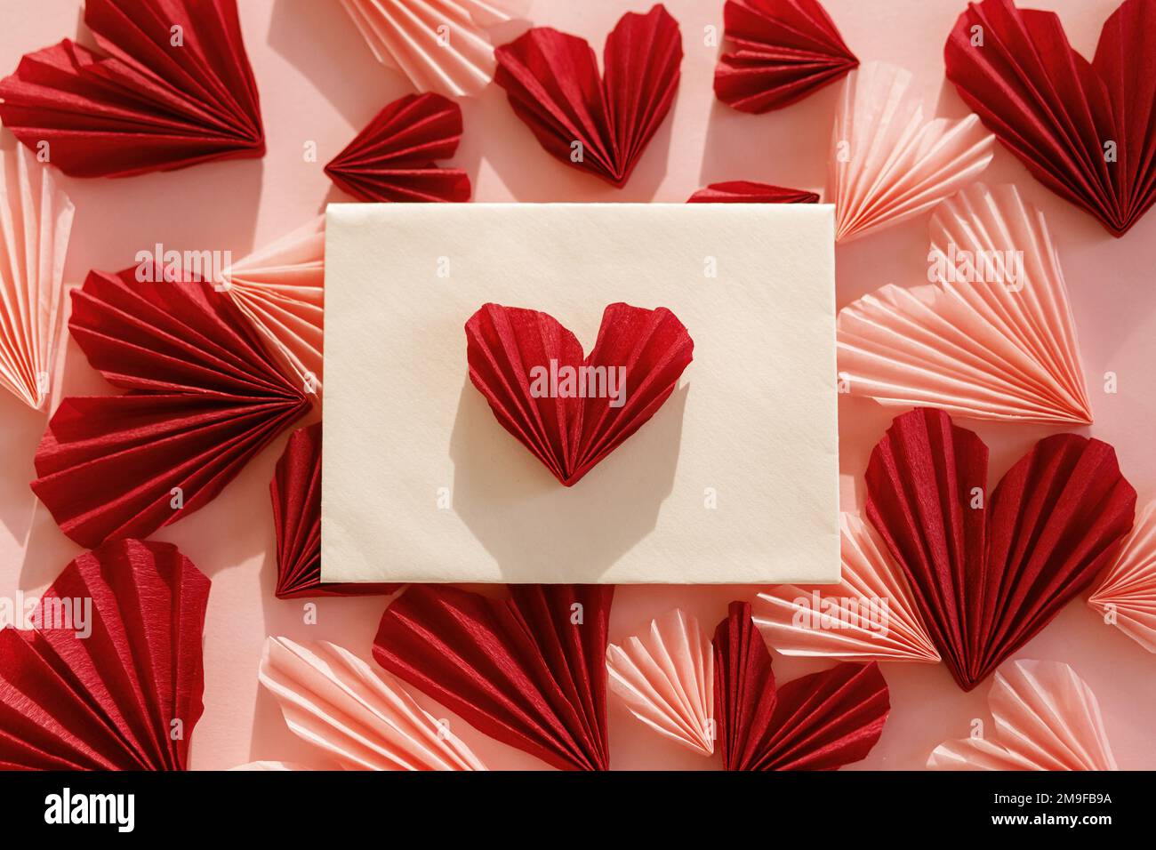 Happy Valentine's day! Stylish envelope with pink and red hearts flat ...