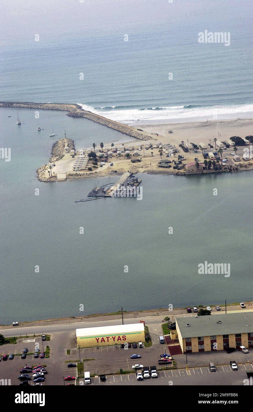An aerial view of United States Navy supply and maintenance barges ...