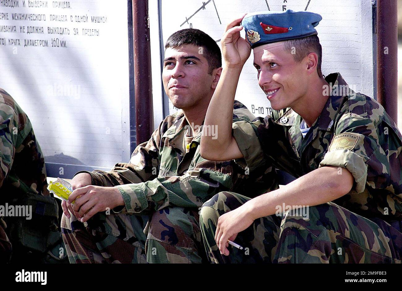 A US Army soldier and a Kazakhstan Army soldier take lunch break during ...