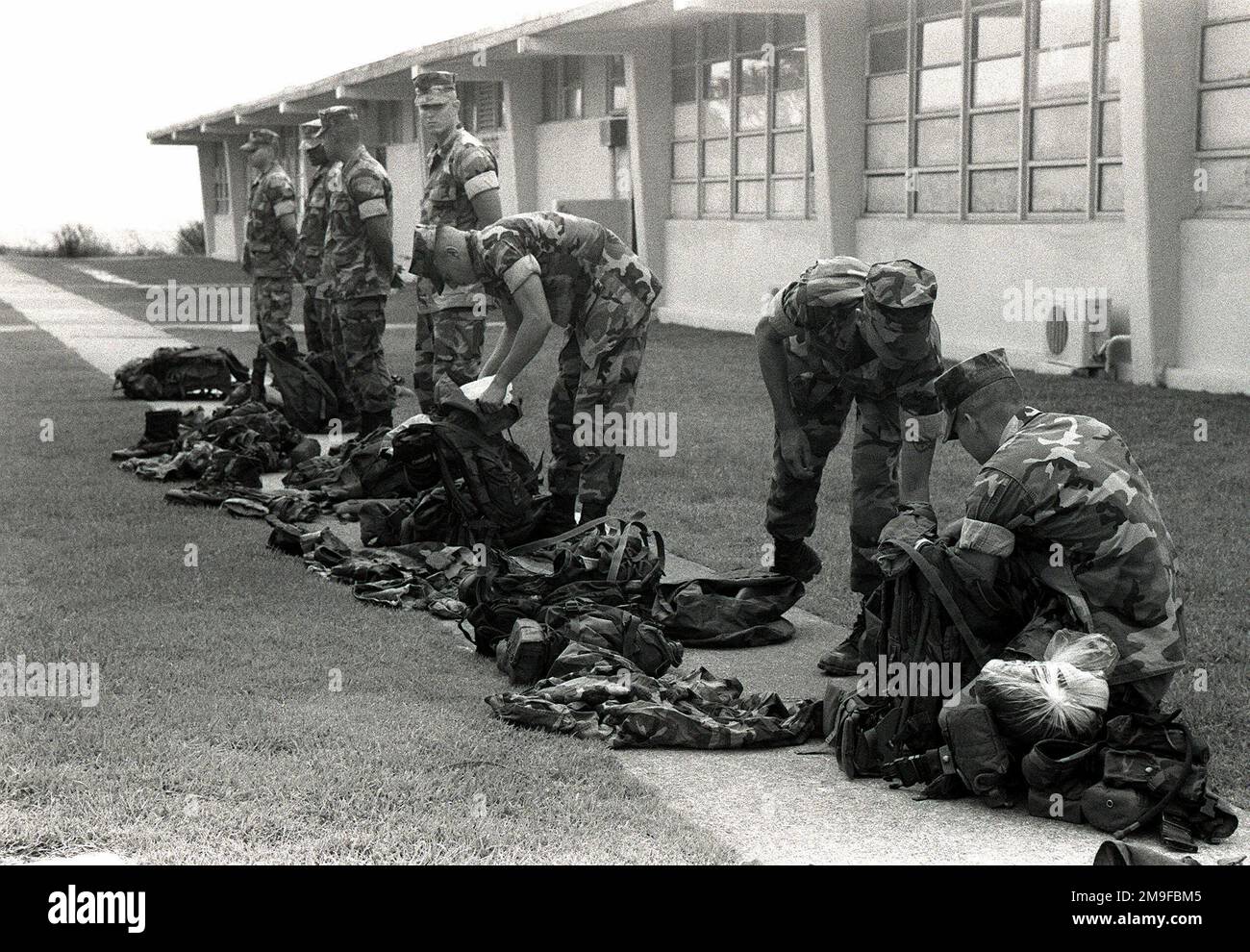 US Marines inventory their gear prior to the beginning of a field ...