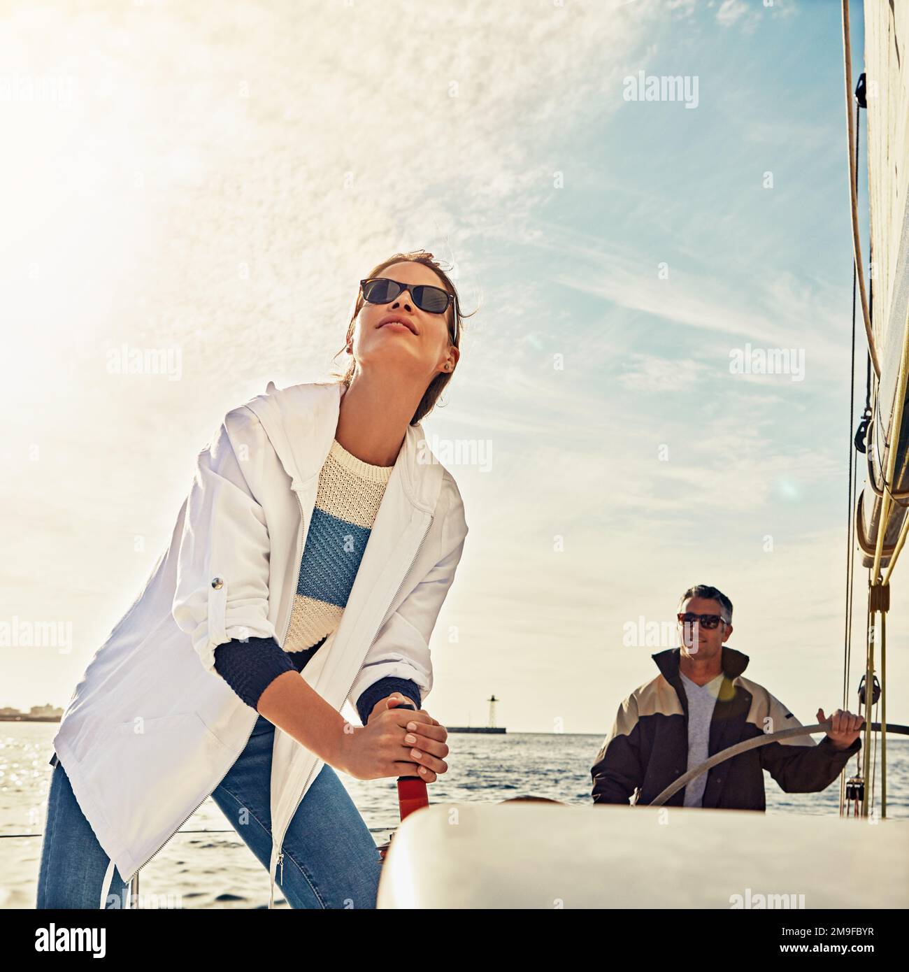Set sail. Sailing, couple and steering helm in sea travel, summer ...