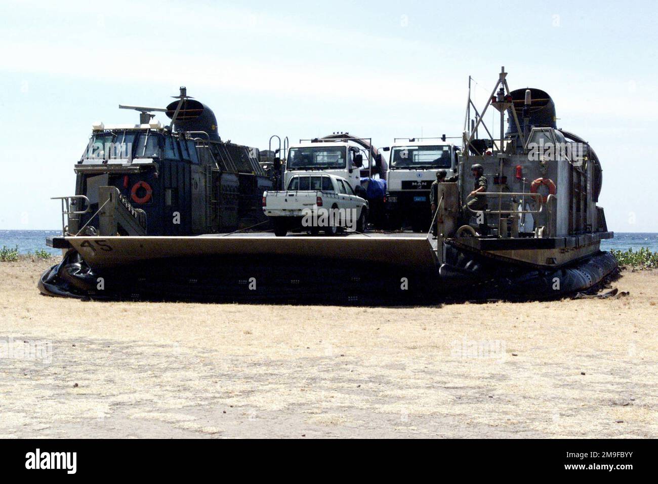 A US Navy Landing Craft Air Cushion (LCAC) with Amphibious Craft Unit 5, attached to Tarawa ...