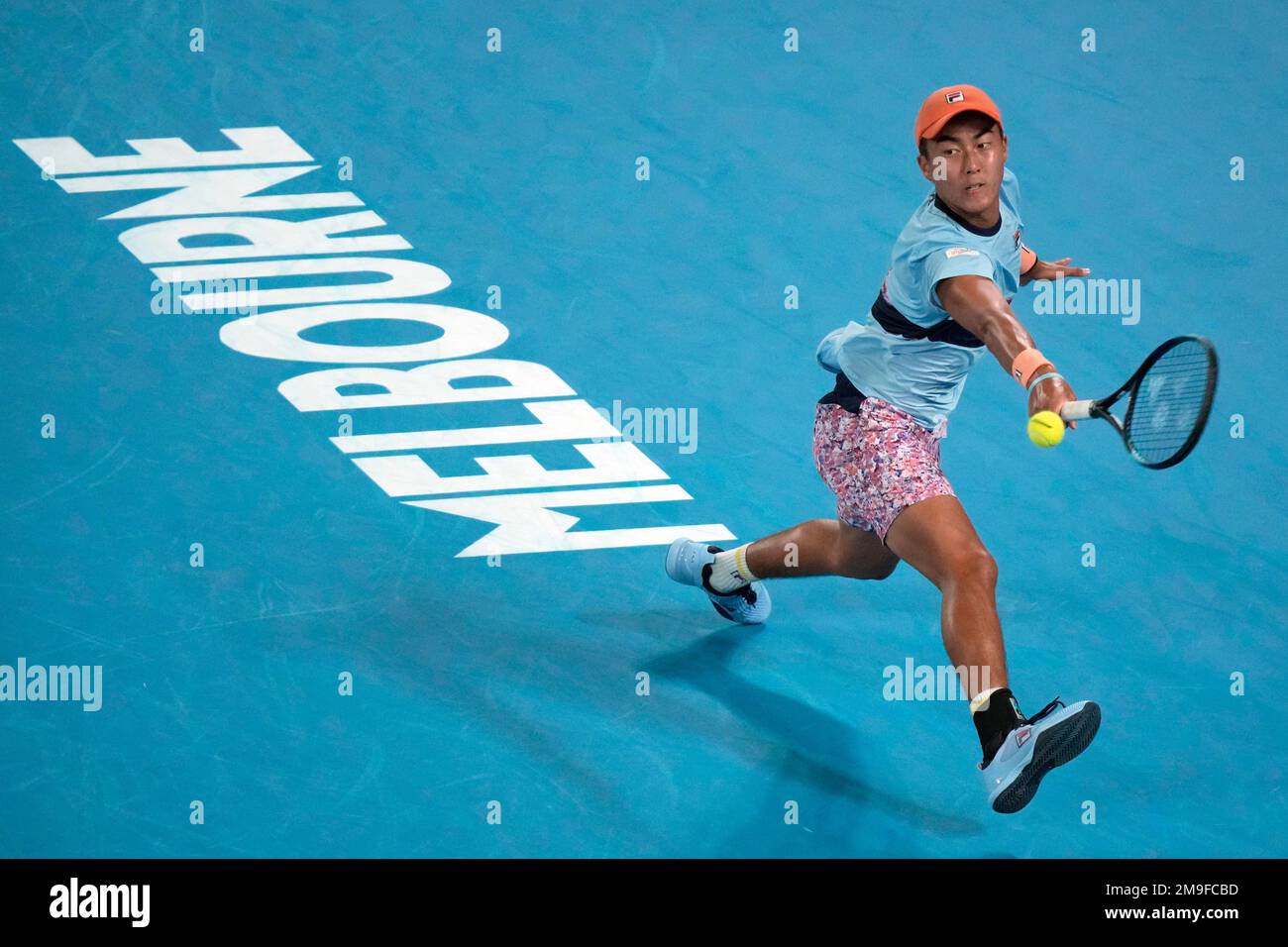 Rinky Hijikata of Australia plays a backhand return to Stefanos ...