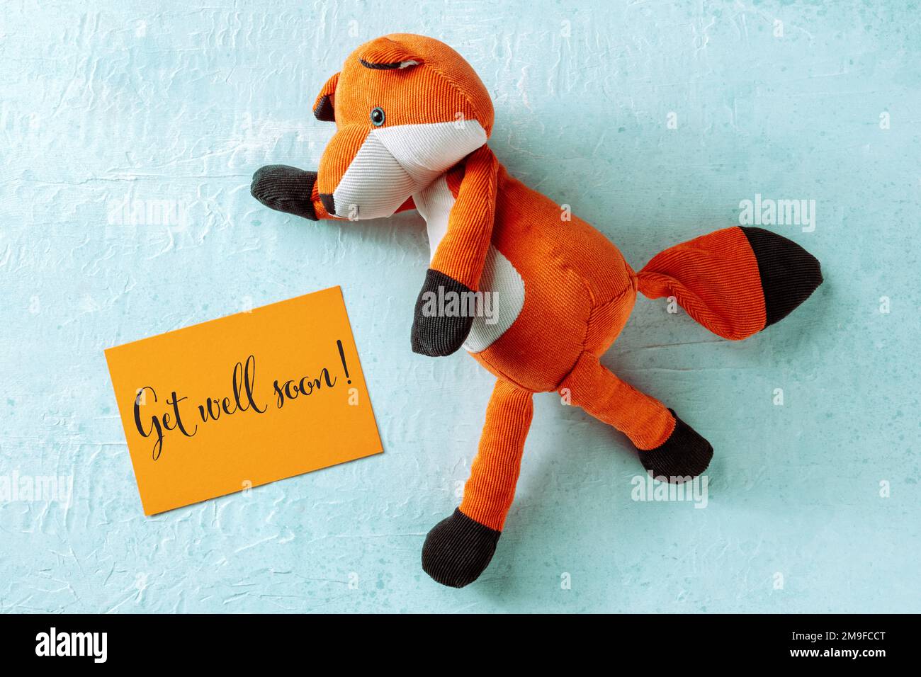 Get Well Soon greeting card with a toy fox, orange paper and blue ...