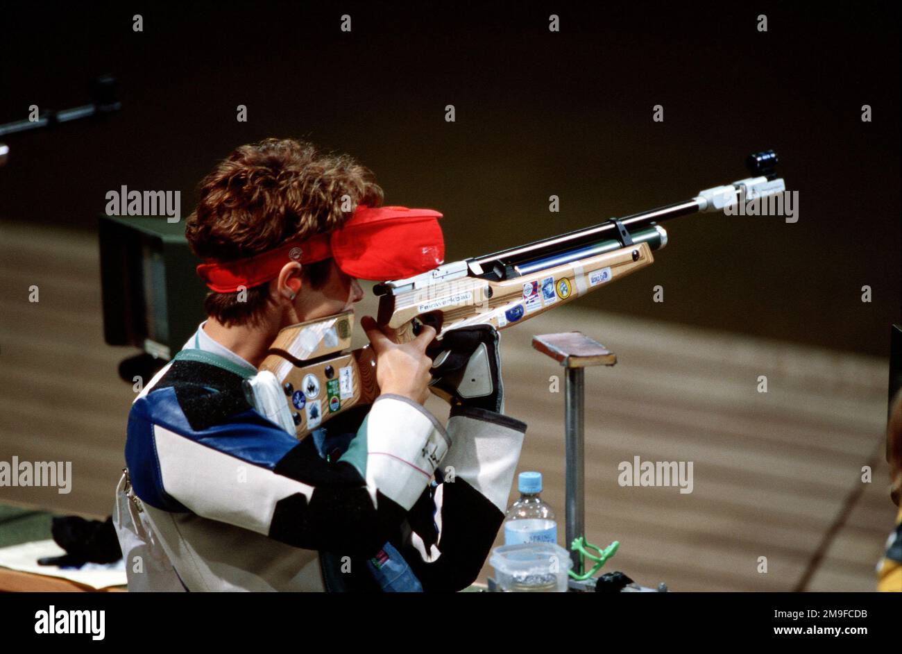 High angle, right rear view of Nancy Johnson as she takes aim for an ...