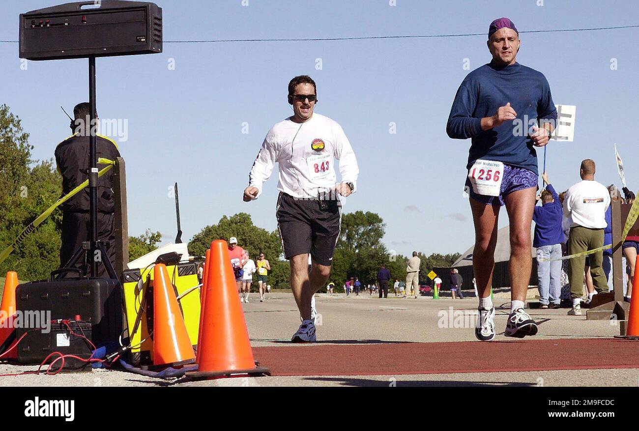 Steve Boyes (right) and Robert Coletto reach the 19.5-mile mark ...