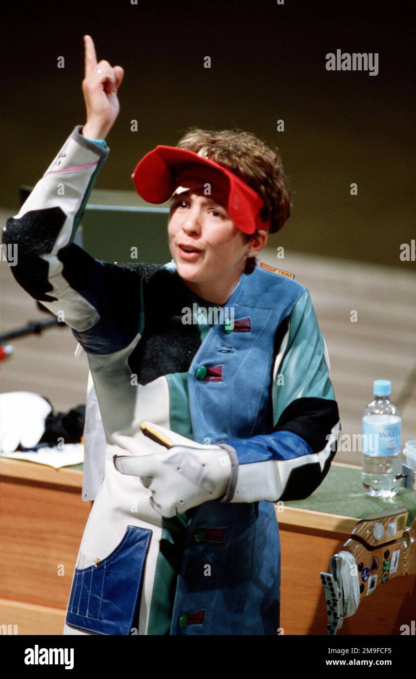 Straight on shot as Nancy Johnson raises her right index finger after ...