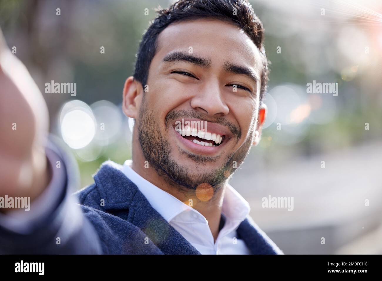 Ill always have this cute face. a handsome businessman taking a selfie ...