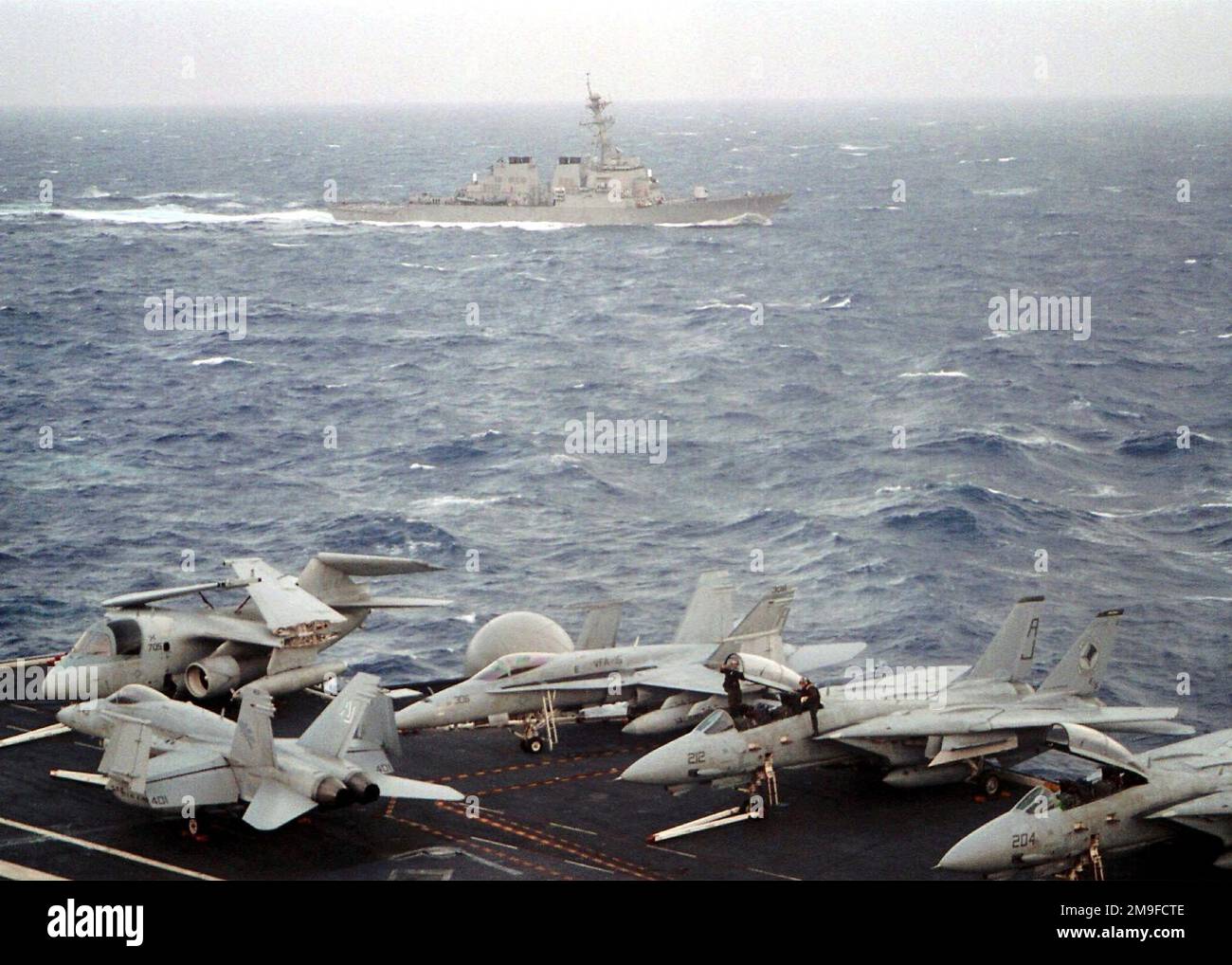 The guided missile destroyer USS MCFAUL (DDG 74) conducts close quarter ...