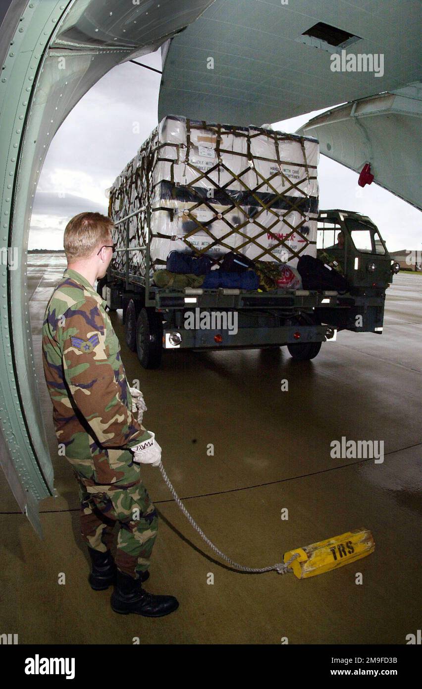 US Air Force Technical Sergeant Kenneth Holmes drives a 25K loader to ...