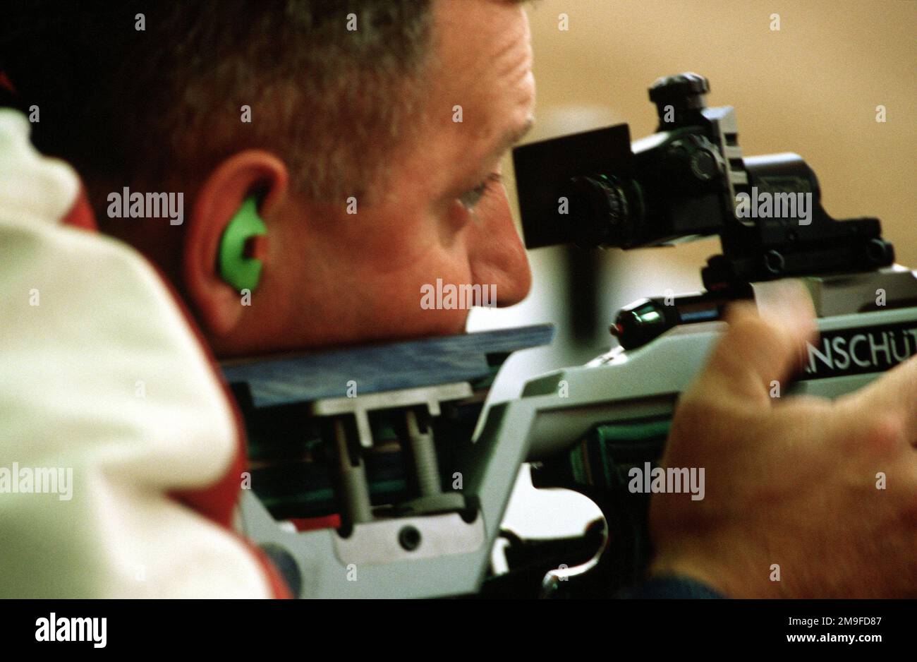 A right side profile, extreme close-up shot, looking down the rifle ...