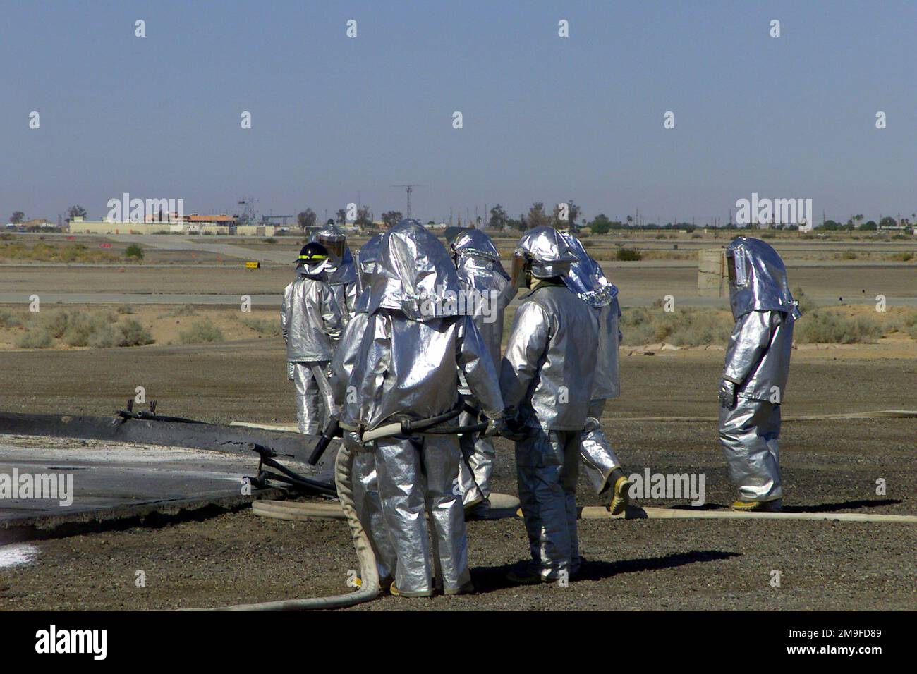 Crash Fire Rescue Marines wait in their fire retardant suits to put out ...