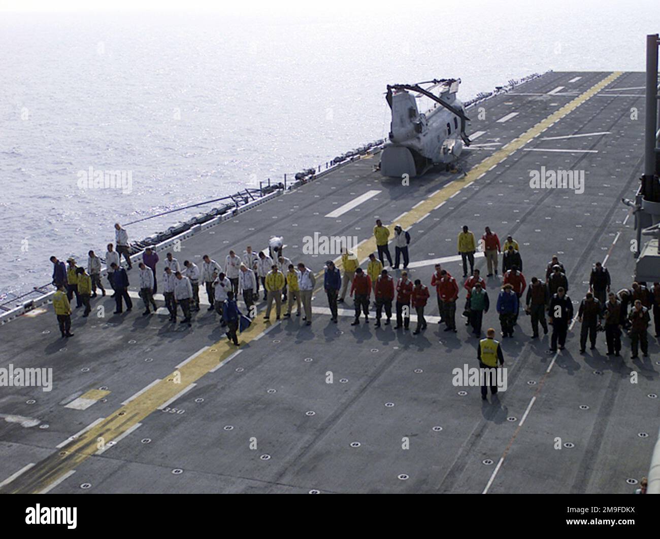 US Navy sailors, perform a Foreign Object Debris (FOD) sweep before ...